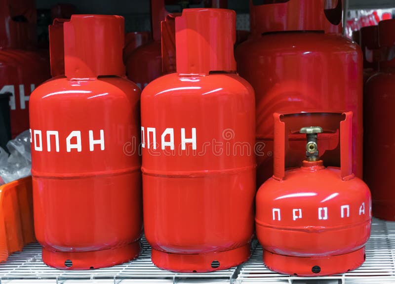 Red Cylinders with Propane Gas. Cylinders with an Inscription in ...