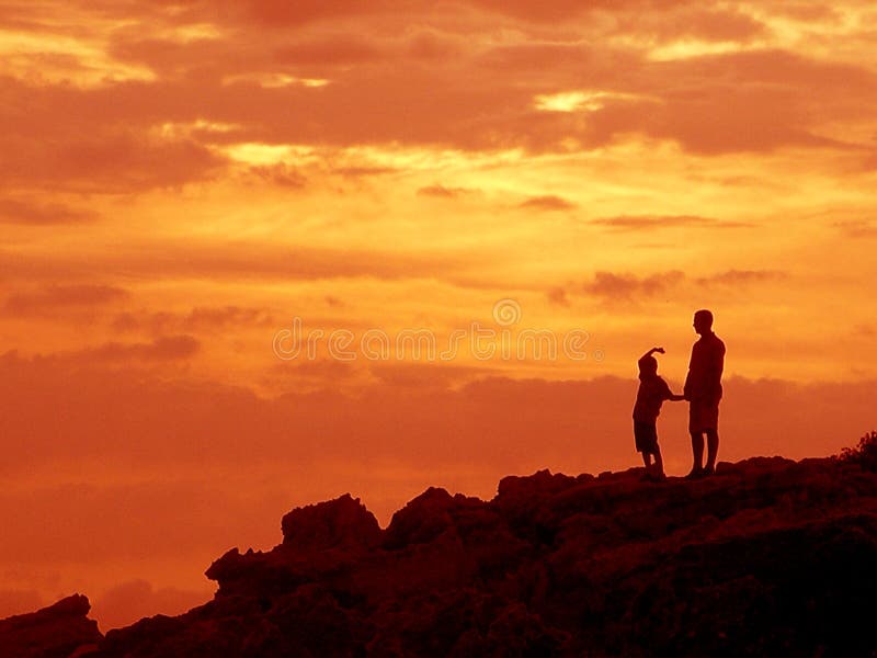 RED DAWN with FATHER and SON Stock Image - Image of family, coast ...