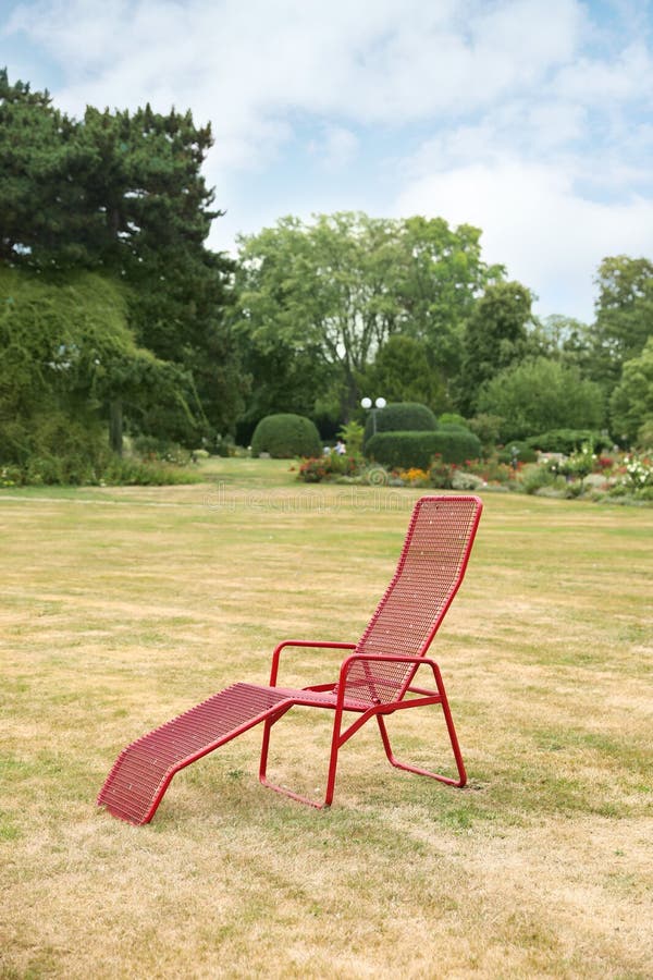 Red Deck Chair on Green Grass in Park Stock Image - Image of holiday ...