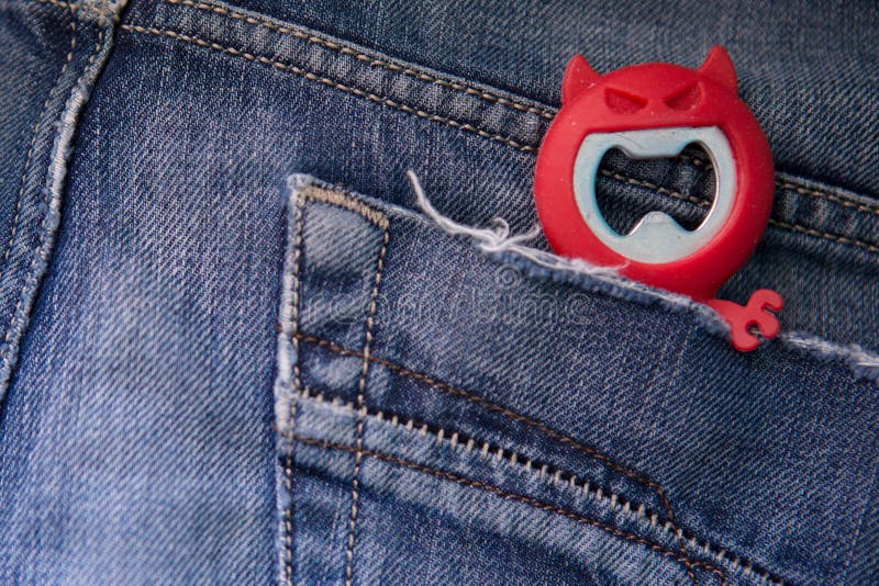 Red devil in jeans pocket stock photo. Image of angry - 70212834