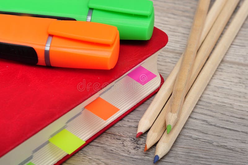 Red Diary Notebook and Colored Pencils, Marker on the Table Wood Stock ...
