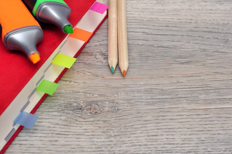 Red Diary Notebook and Colored Pencils, Marker on the Table Wood Stock ...