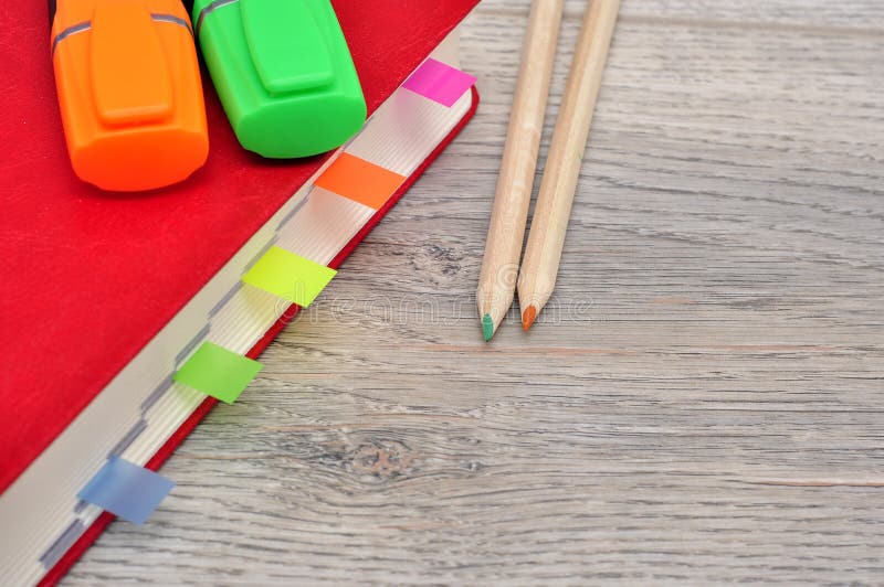 Red Diary Notebook and Colored Pencils, Marker on the Table Wood Stock ...