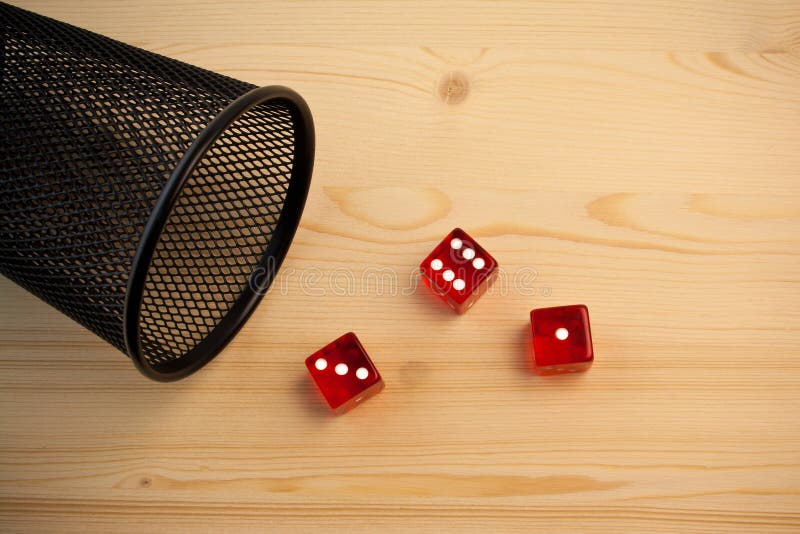 Red dice near a container stock image. Image of pair - 22335139