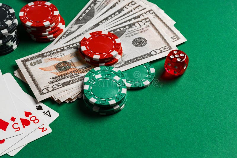 Red Dice, Playing Cards, and Chips on Green Felt Tabletop Stock Photo ...