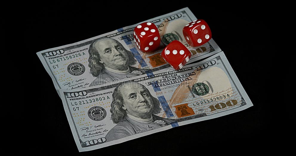 Red Dice Rolling on Dollar Bills Against Black Background Stock Image ...