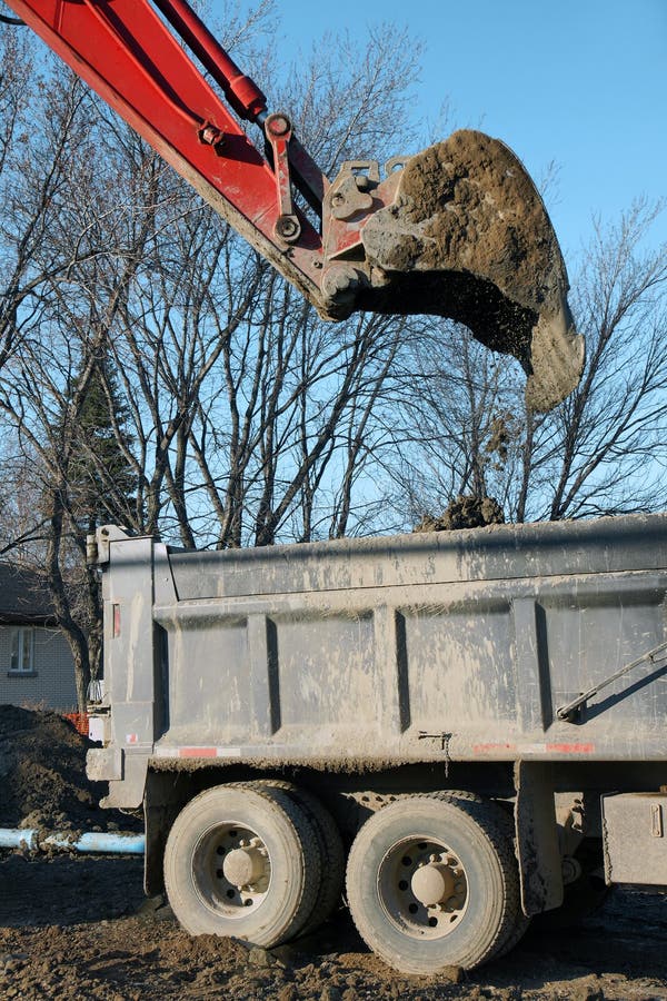 Red Digger Dumping Dirt Vertical Stock Photo - Image of industry ...