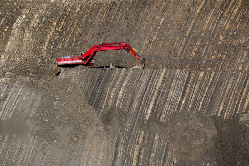 Red digger in stone-pit stock photo. Image of bulldozer - 78779996