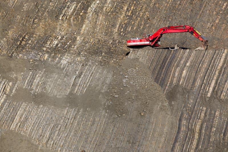 Red digger in stone-pit stock photo. Image of machine - 78780086