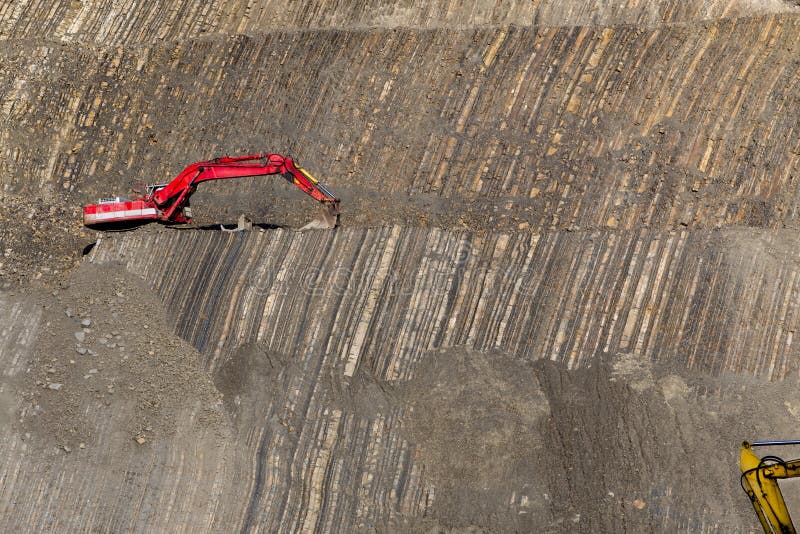 Red digger in stone-pit stock photo. Image of excavation - 78780242
