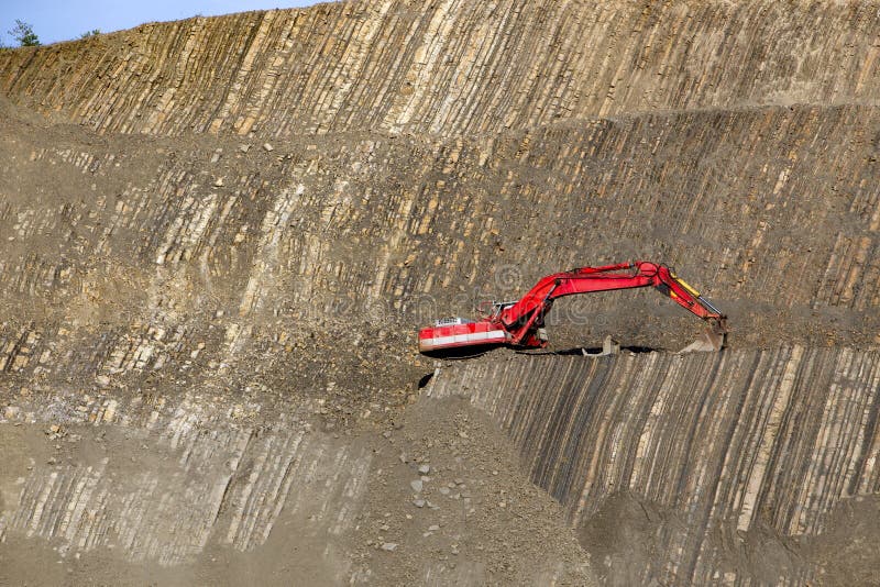 Red digger in stone-pit stock image. Image of vehicle - 78780297