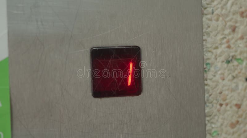 Red Digital Number Displaying Count Down Numbers on a Modern Elevator ...