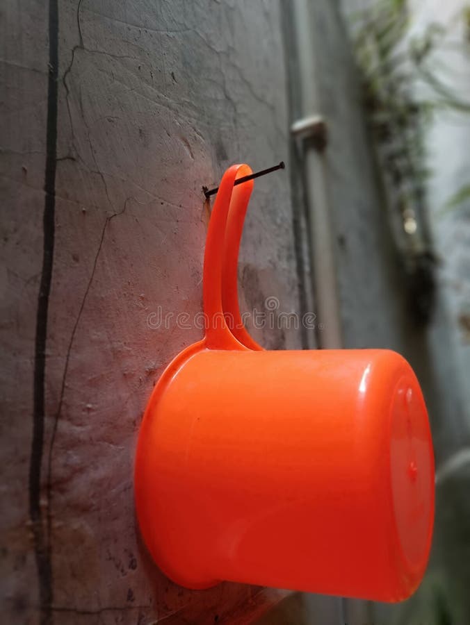 Red Dipper Hanging on the Wall Stock Photo - Image of vehicle, pink ...