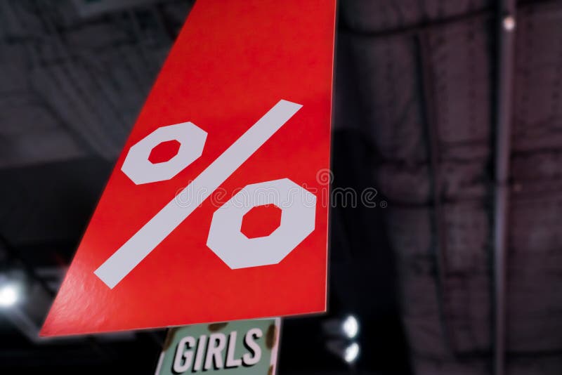 Red Discount Sign in the Clothing Store Stock Photo - Image of ...