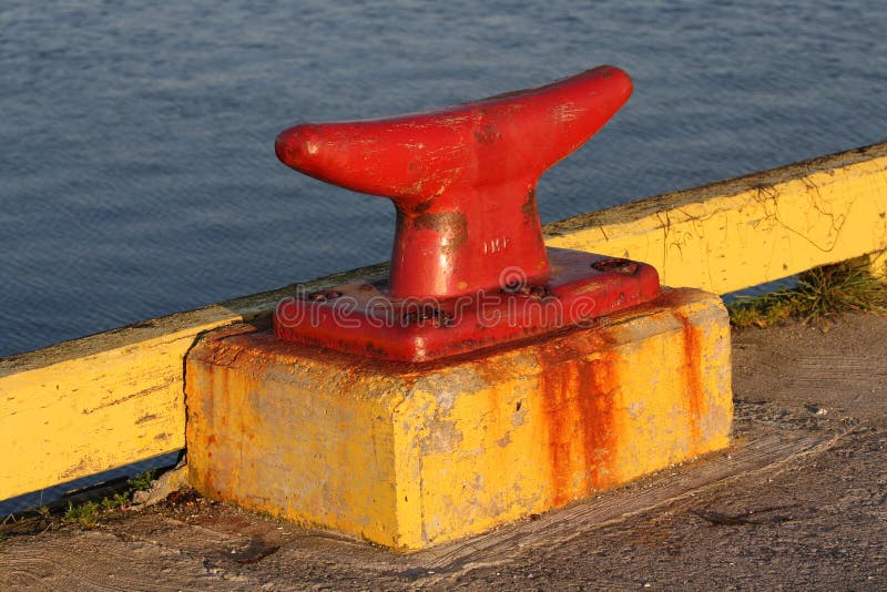 Red Dock Cleat with Yellow Base Stock Photo - Image of railing ...