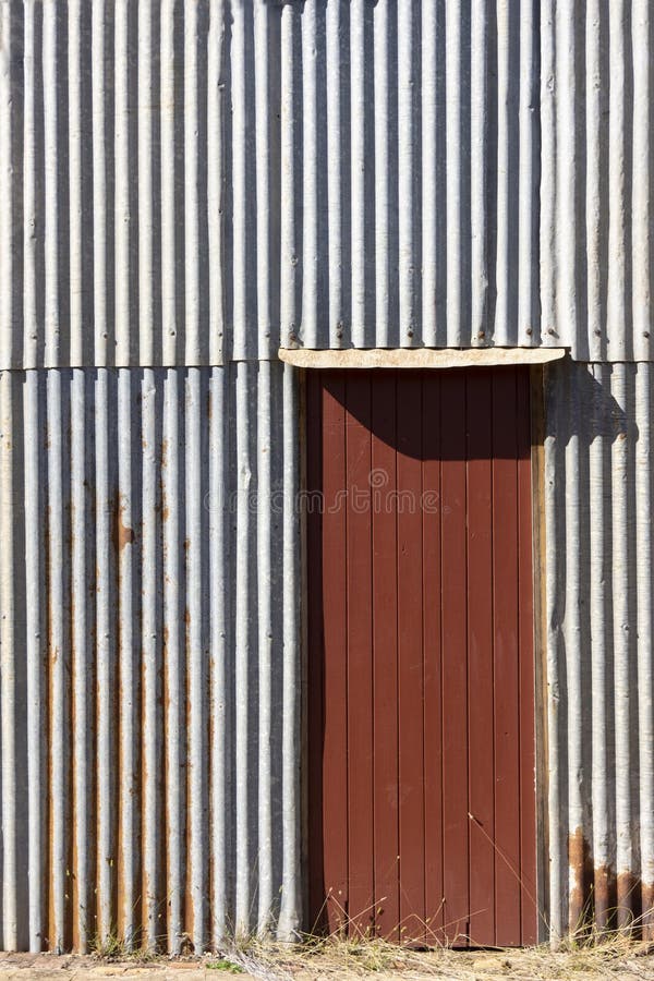 Red Door in a Corrugated Iron Wall Stock Image - Image of wood ...