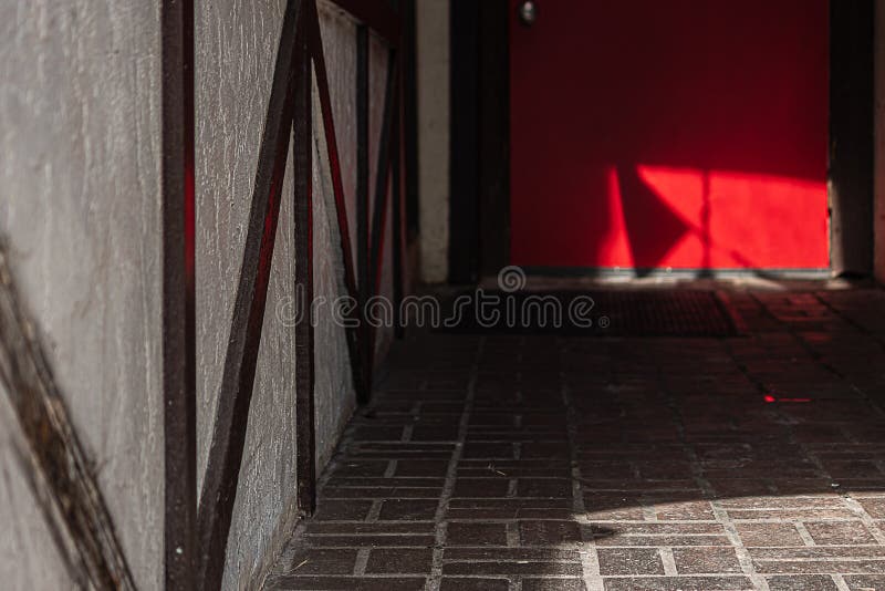 Rd Door at the End of a Cobble Stone Path Stock Image - Image of gray ...