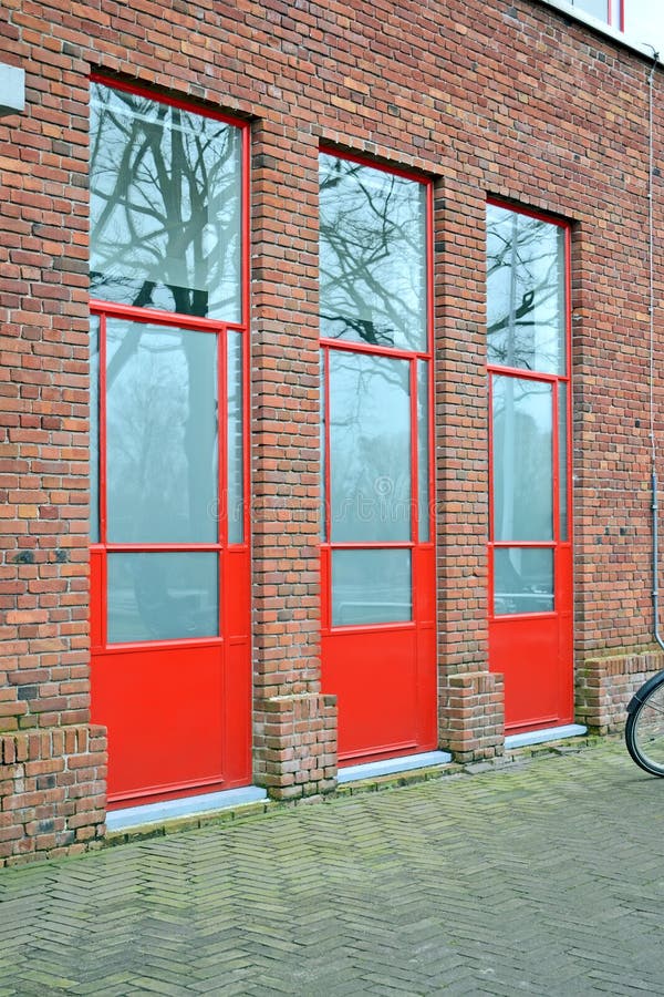 Red Doors on the Brick Wall, Building Industry, Stock Photo - Image of ...