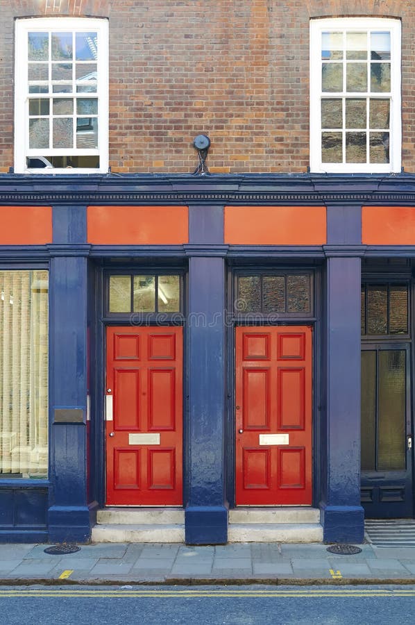 Red doors on building stock image. Image of sidewalk - 28030843