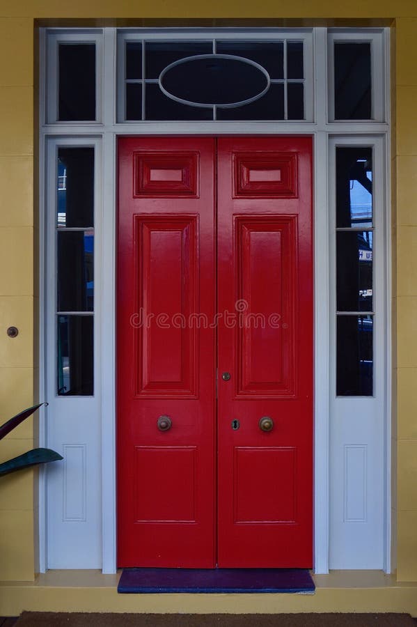 A Red Double Door in Front of a Building Editorial Photo - Image of ...