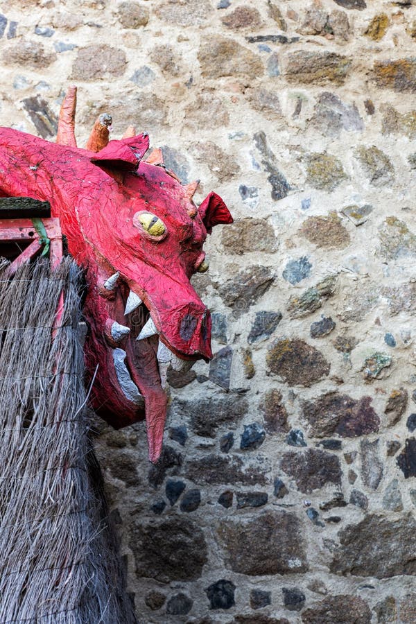 Red Dragon Statue in Front of a Stone Wall Stock Image - Image of ...