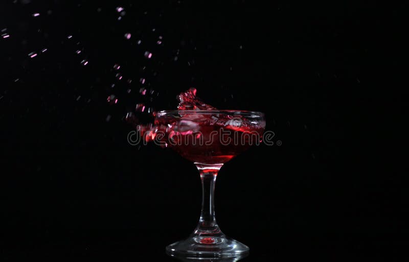 Red Drink Splash into the Glass with Black Background Stock Image ...