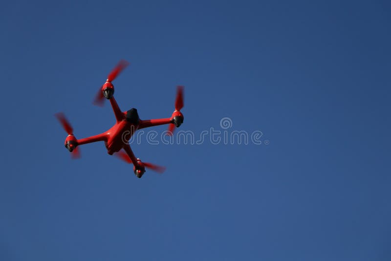 Red Drone on a Blue Background Stock Photo - Image of mountain, blue ...