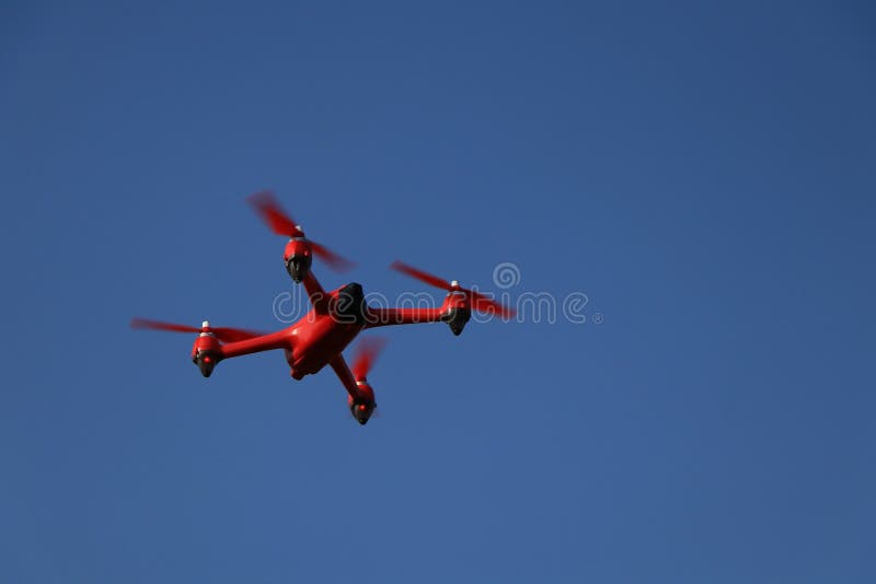 Red Drone on a Blue Background Stock Photo - Image of flying, galassi ...