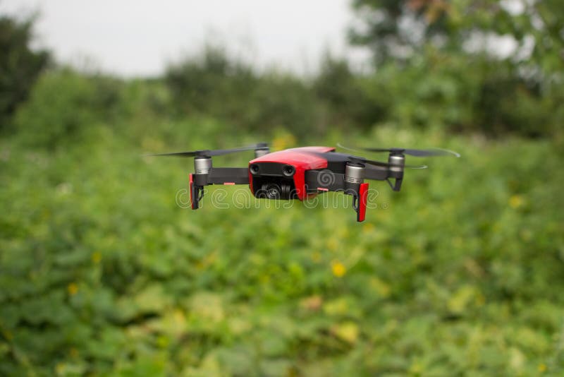 Red Drone Hovering in the Air Stock Image - Image of technology, nature ...
