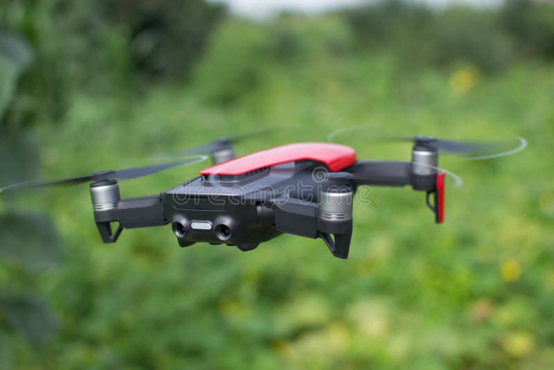 Red Drone Hovering in the Air Stock Image - Image of aviation, nature ...