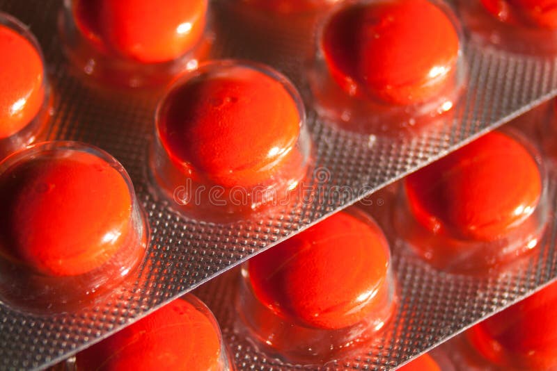 Red drugs on packed stock image. Image of sickness, packed - 18558977