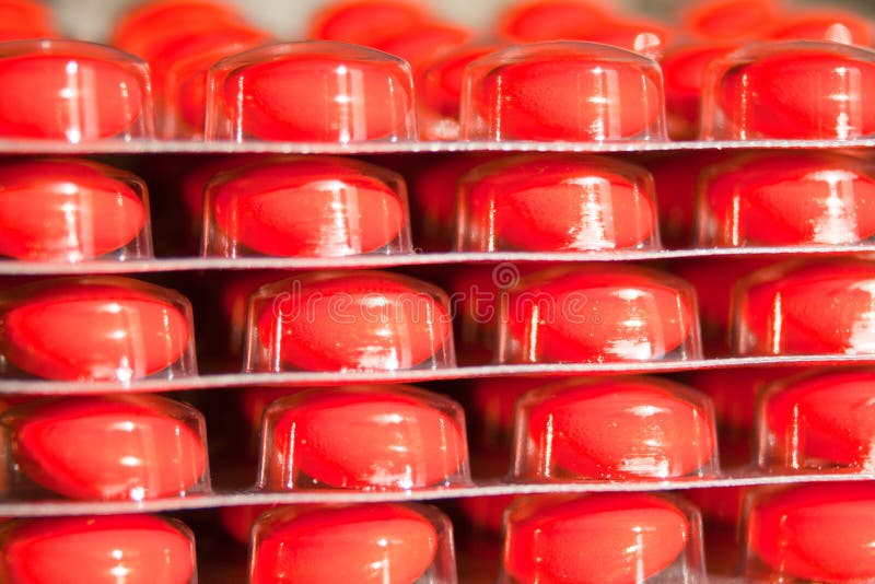 Red drugs on packed stock photo. Image of pill, health - 18559016