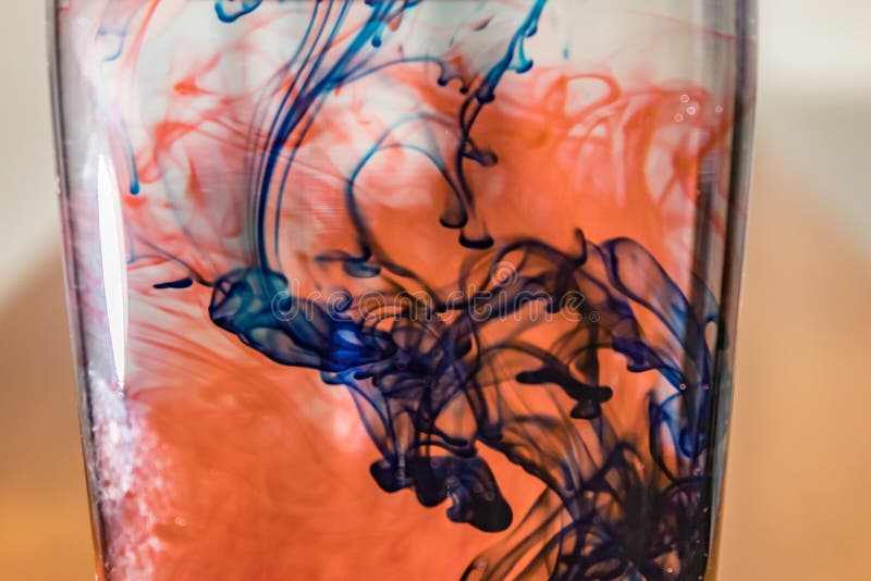 Red dyed liquid with blue stock photo. Image of diffusion - 116386818