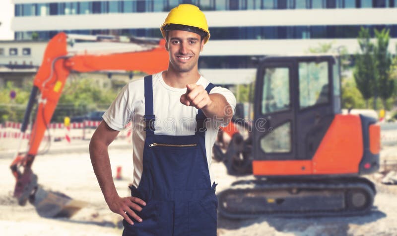 Red Earthmover with Pointing Latin American Construction Worker Stock ...