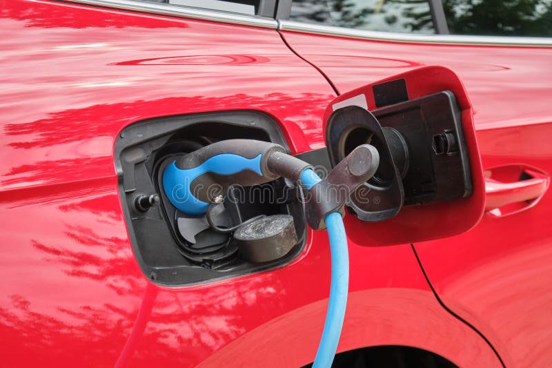 Red Electric Car Charging - Close Up of Charger Stock Image - Image of ...