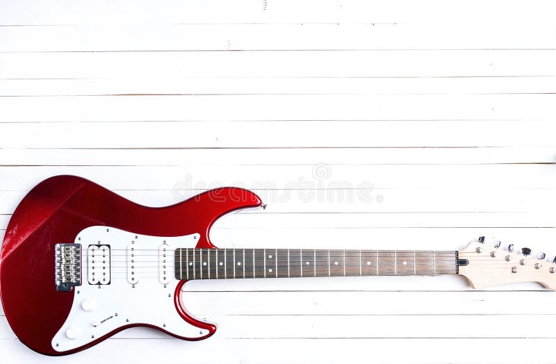 Red Electric Guitar on White Wooden Table. Stock Photo - Image of ...