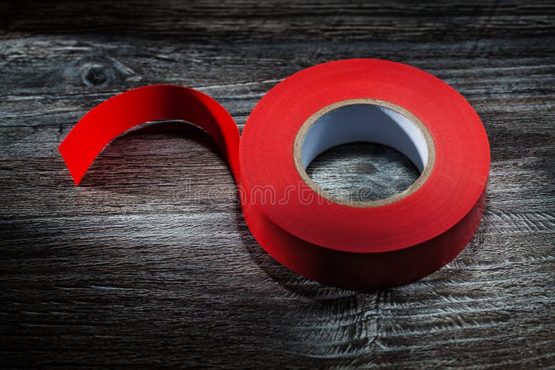 Red Electrical Tape on Vintage Wooden Board Stock Image - Image of ...