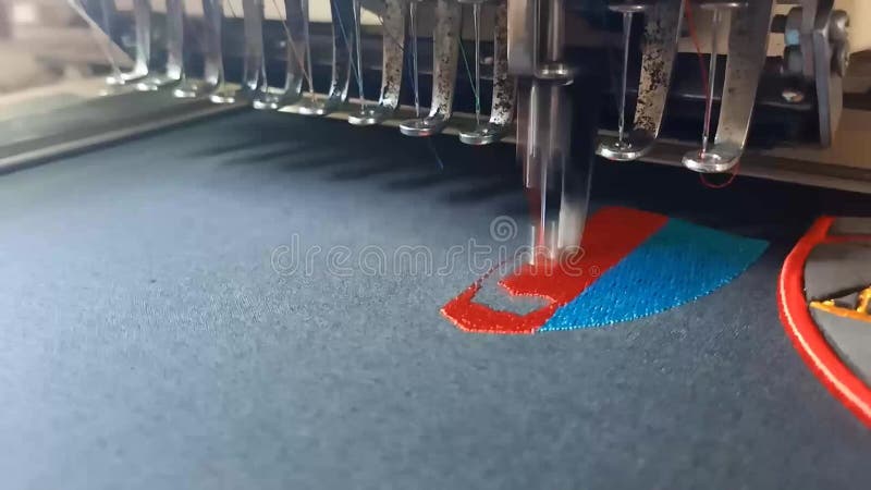 Red Embroidery during the Process of Making a Logo Using a Digital ...