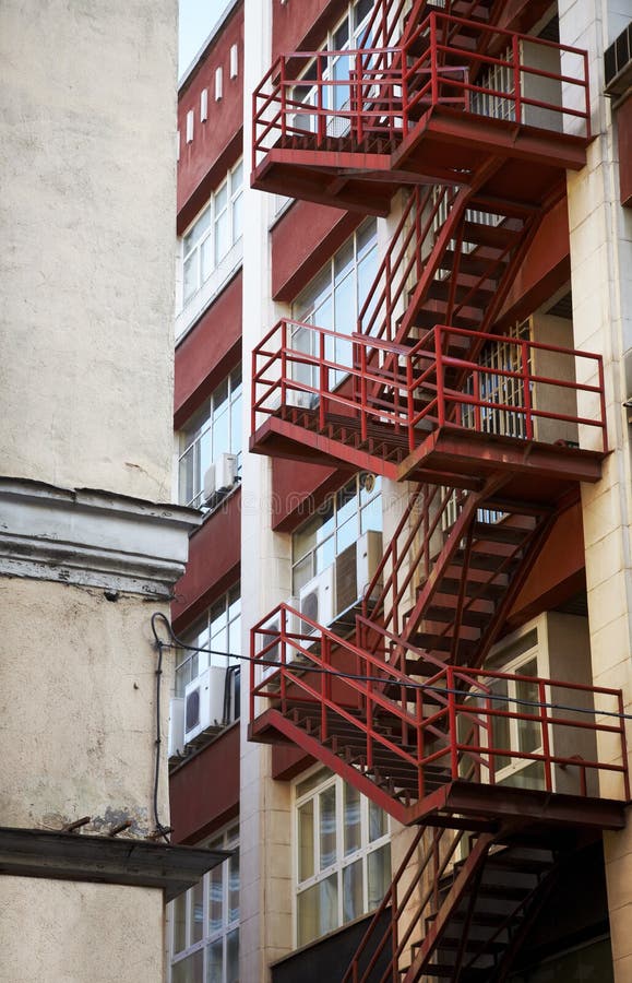 Red Emergency Staircase in a Building Facade Stock Image - Image of ...