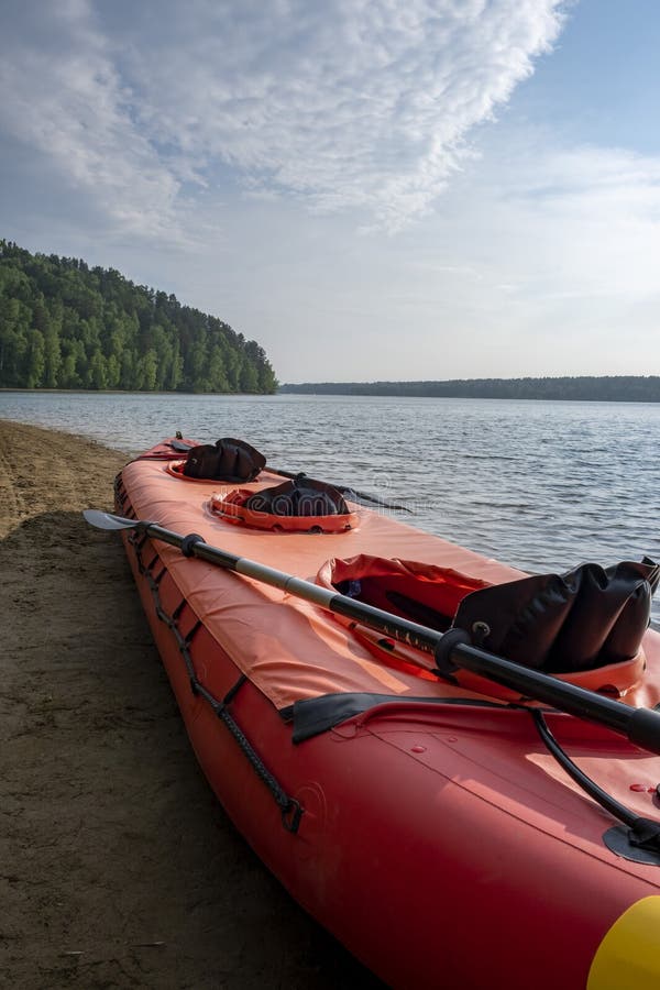 Red Empty Kayak by the Shore of a River. Stock Photo - Image of relax ...