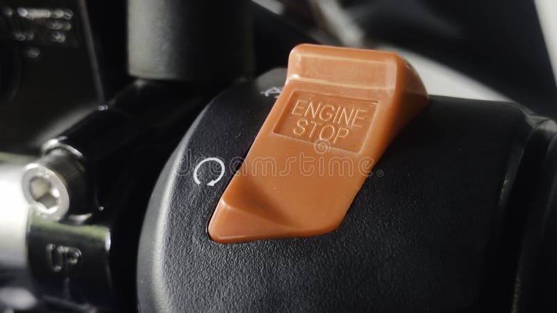 Red Engine Stop Switch on Black Surface with Rotational Arrow Symbol ...