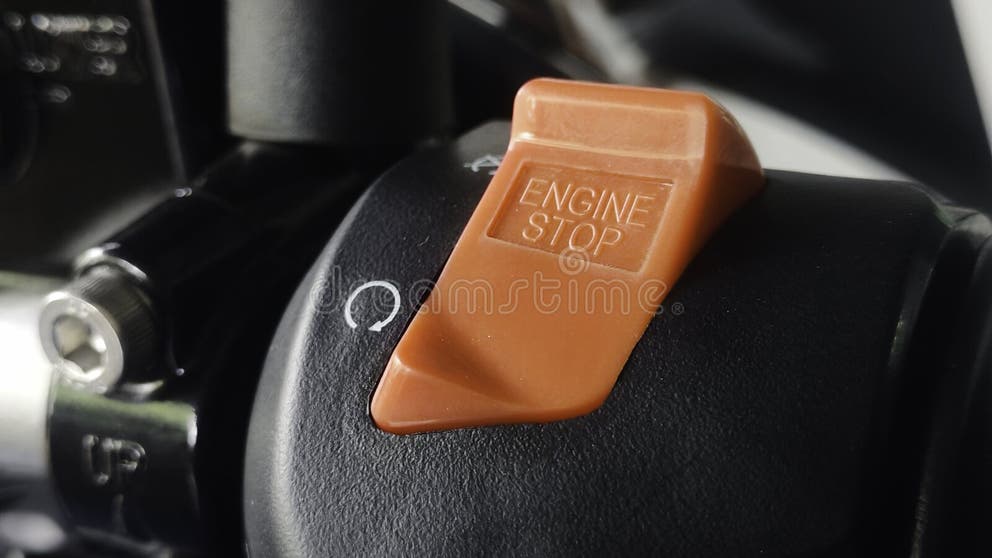 Red Engine Stop Switch on Black Surface with Rotational Arrow Symbol ...