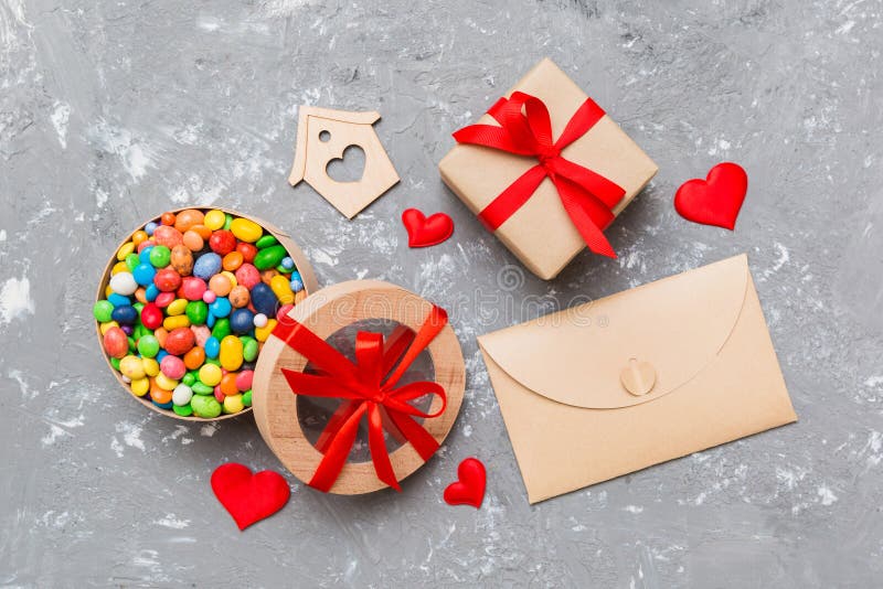 Red Envelope with Candy and Gift Box and Valentines Hearts on Colored ...