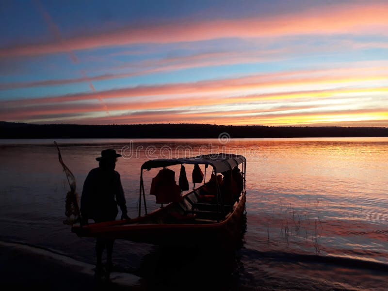 Red Evening Sky by the Dam with a Boat Stock Image - Image of blue ...