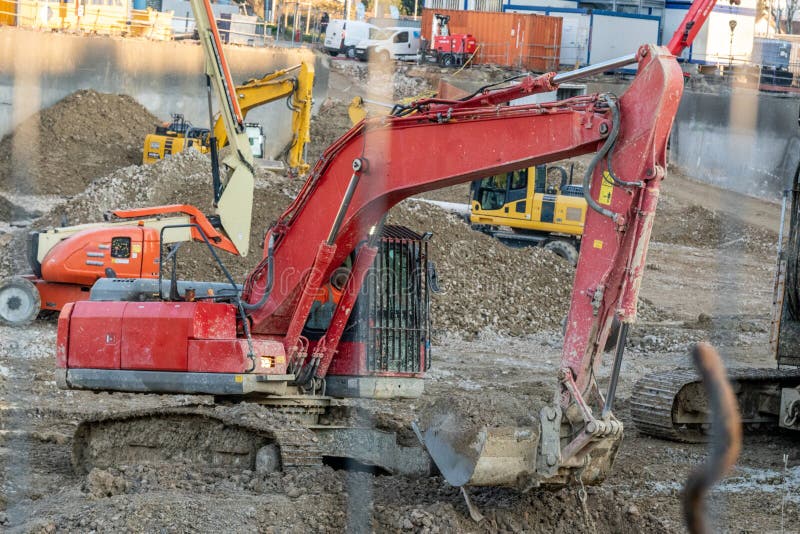 Red Excavator Working on Construction Site Stock Image - Image of ...