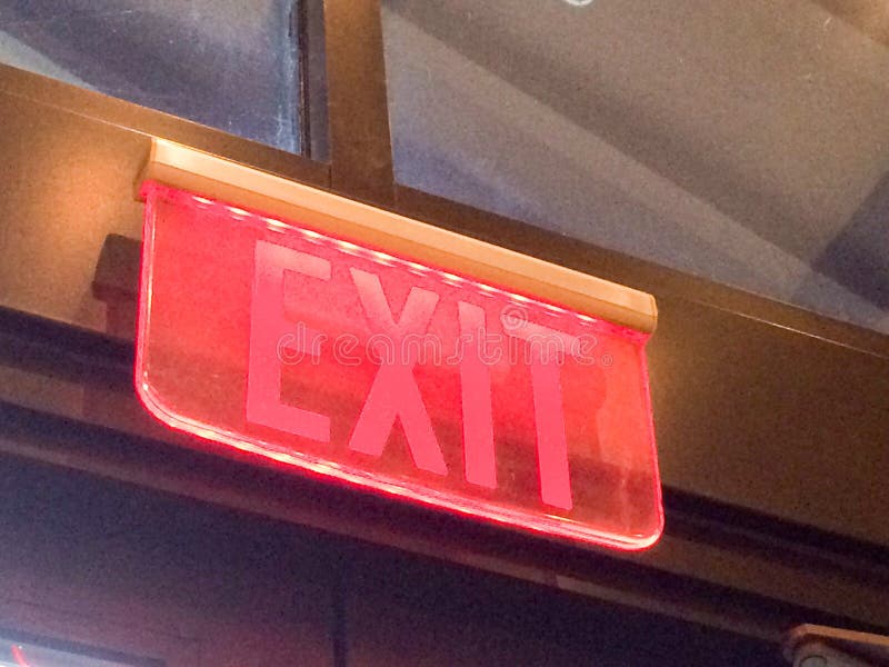 Red Exit Sign Illuminated at Emergency Exit Door Stock Photo - Image of ...