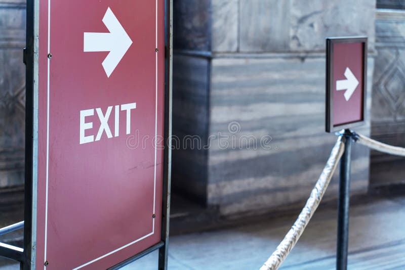 Red Exit Signs with White Arrows Provide Clear Direction for Safe and ...