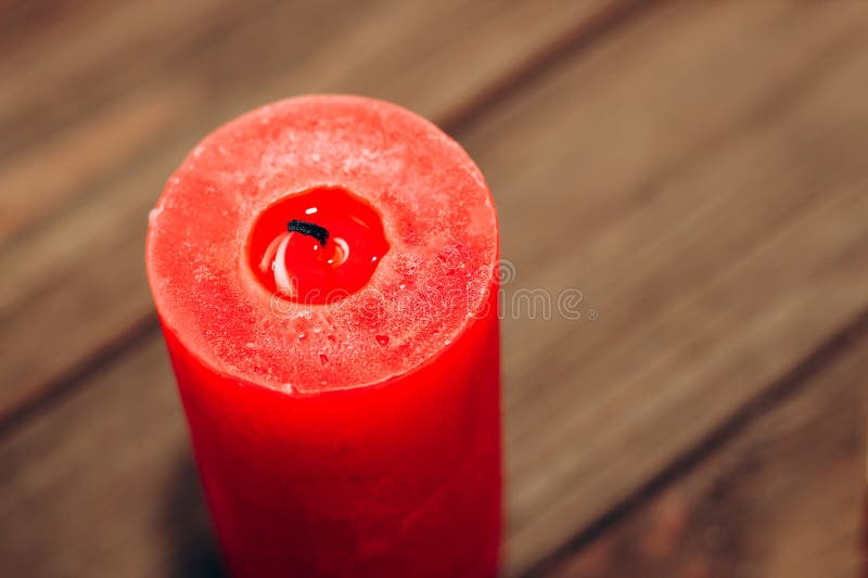 Red Extinguished Aroma Candle on the Background of Wooden Planks. Stock ...