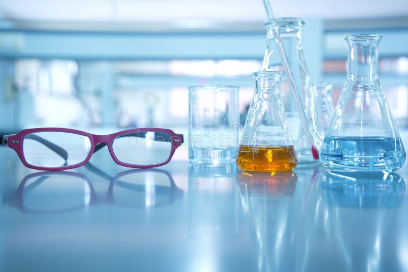 Two Orange Red and Blue Flask with Chemical Structure in Research ...