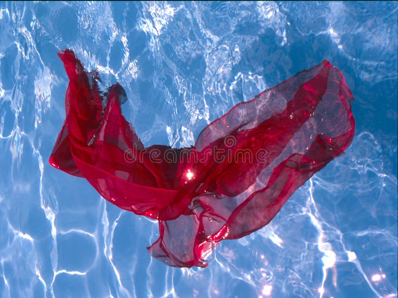 Red Fabric Floating in Pool Stock Image - Image of lookup, rainy: 112519861